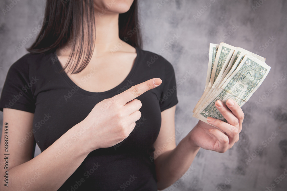 girl holding big money in her hands Stock Photo | Adobe Stock