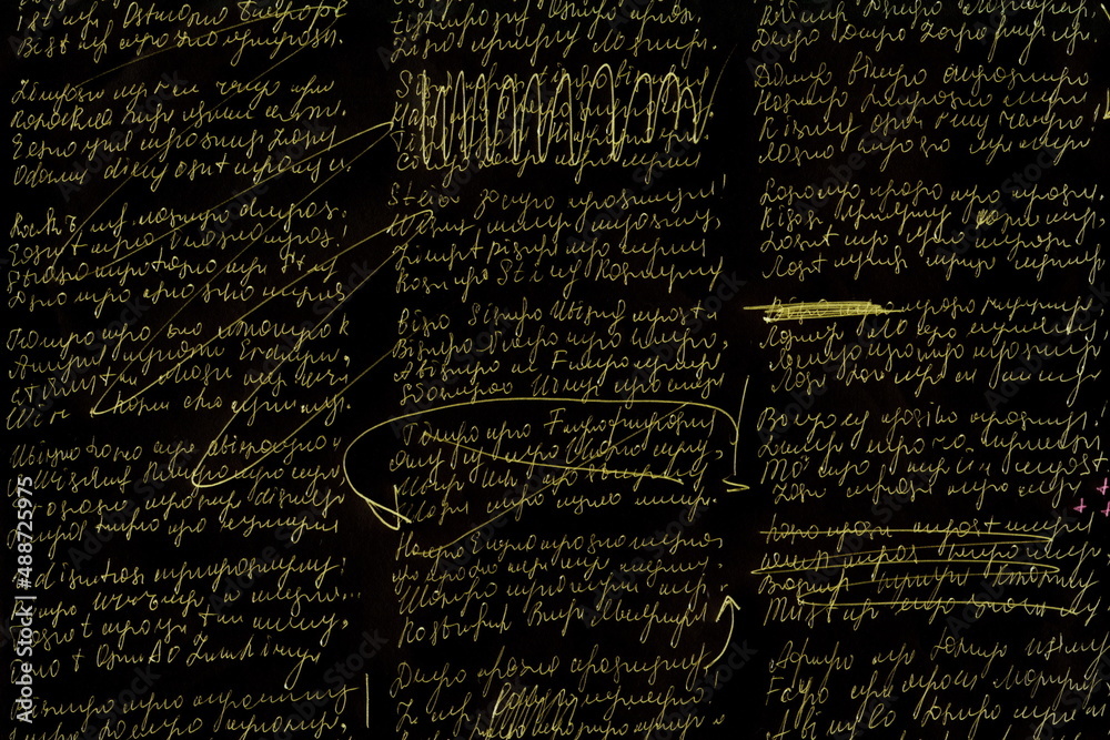 Grunge texture of unreadable handwriting on a black background ...