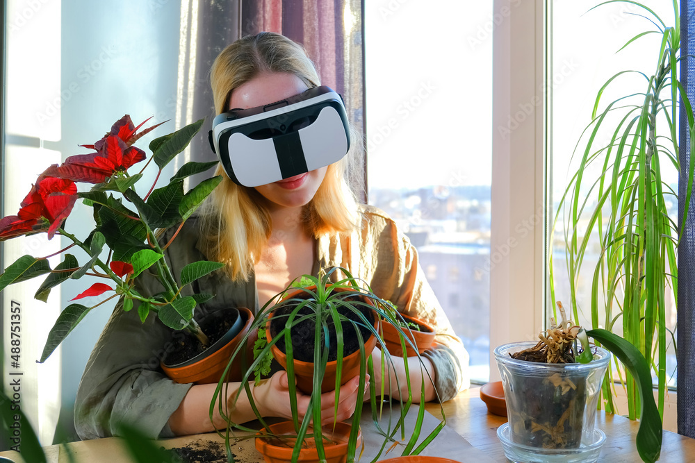 Gardening.Virtual world, metaverse.Girl planting flowers in immersive ...