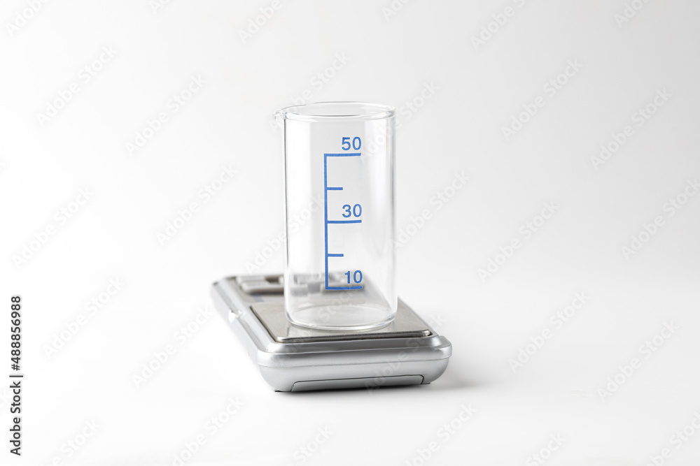 Equipmen with glass volumetric flask with measurement on scales on ...