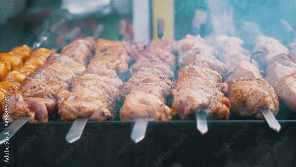 Juicy Pork Kebabs are Fried on an Open Grill in Smoke and Soot ...