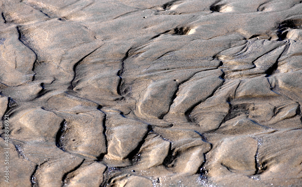 Traces of waves on the sand with seawater Stock Photo | Adobe Stock