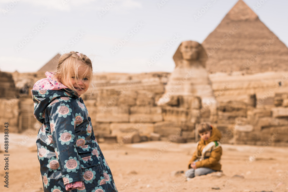 happy little girl and boy plaing on background of Great Sphinx and ...