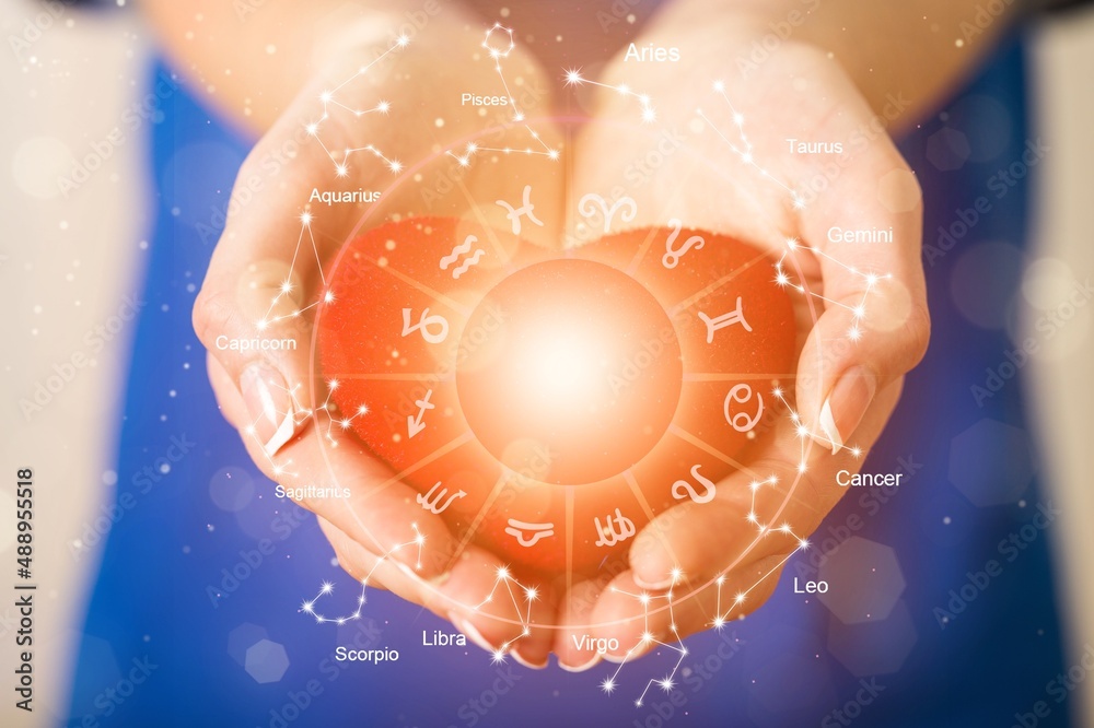 The hands are the heart shape with the sun light passing through the ...