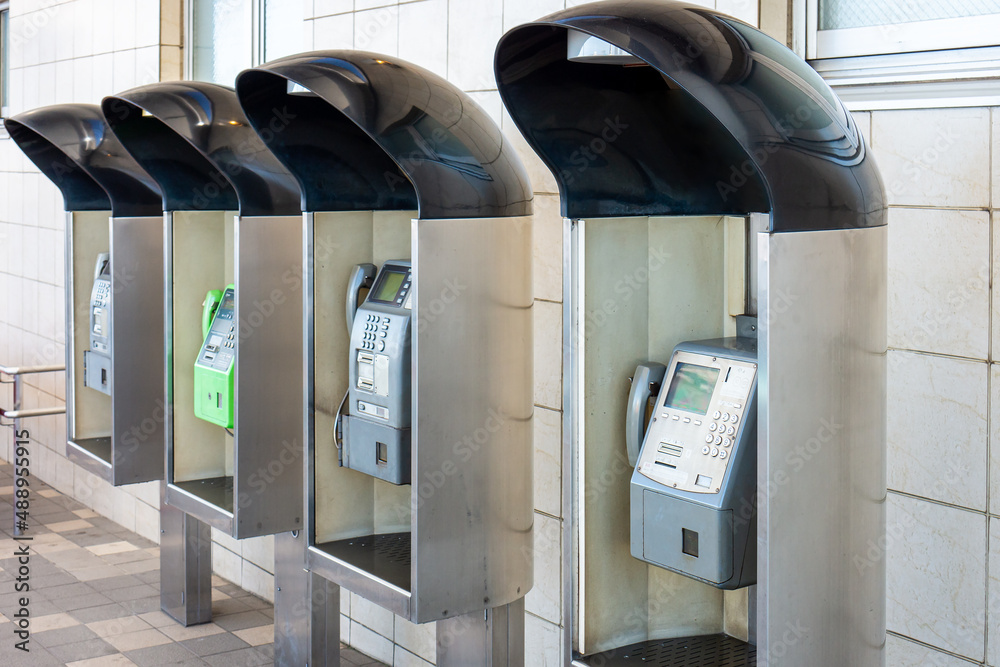Old outdoor public landline telephone booths. They are land-line, fixed ...