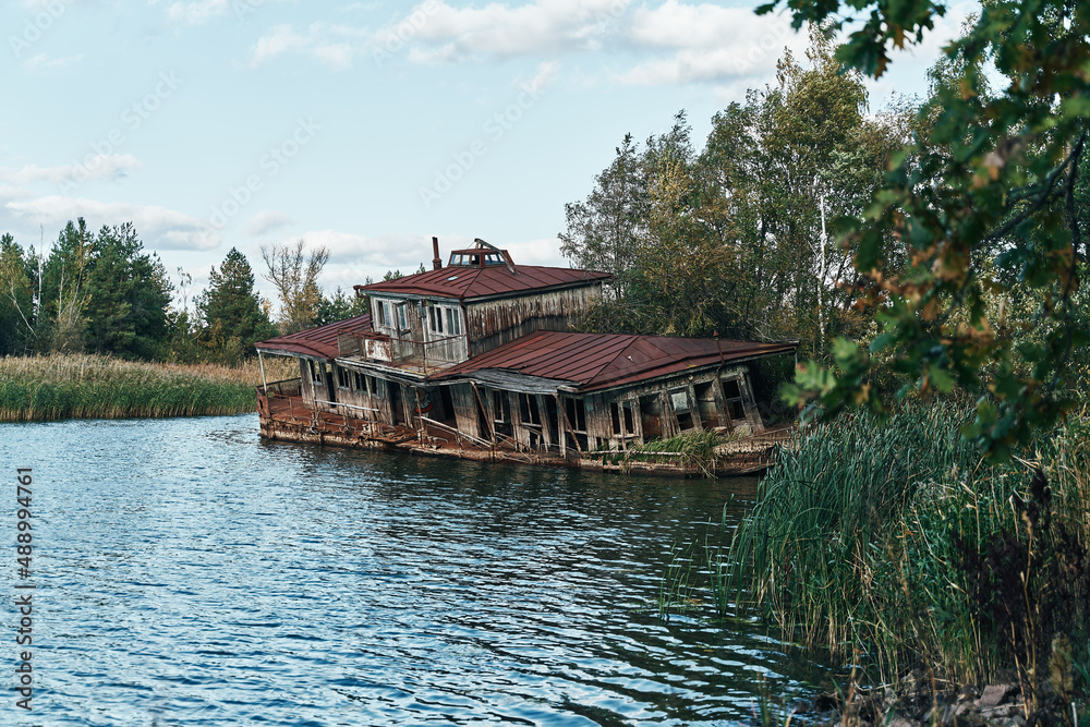 Abandoned floating boat restaurant in the harbour of ghost town Pripyat ...