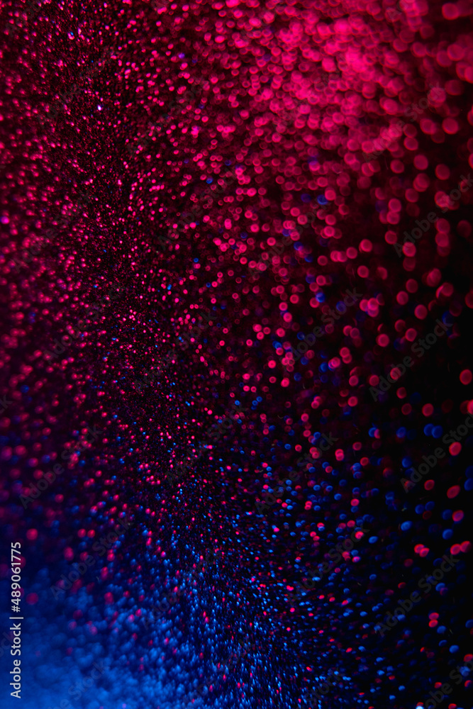 Color bokeh glow. Glitter background. Wet asphalt reflection. Defocused ...