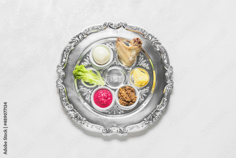 Passover Seder plate with traditional food on white background Stock ...