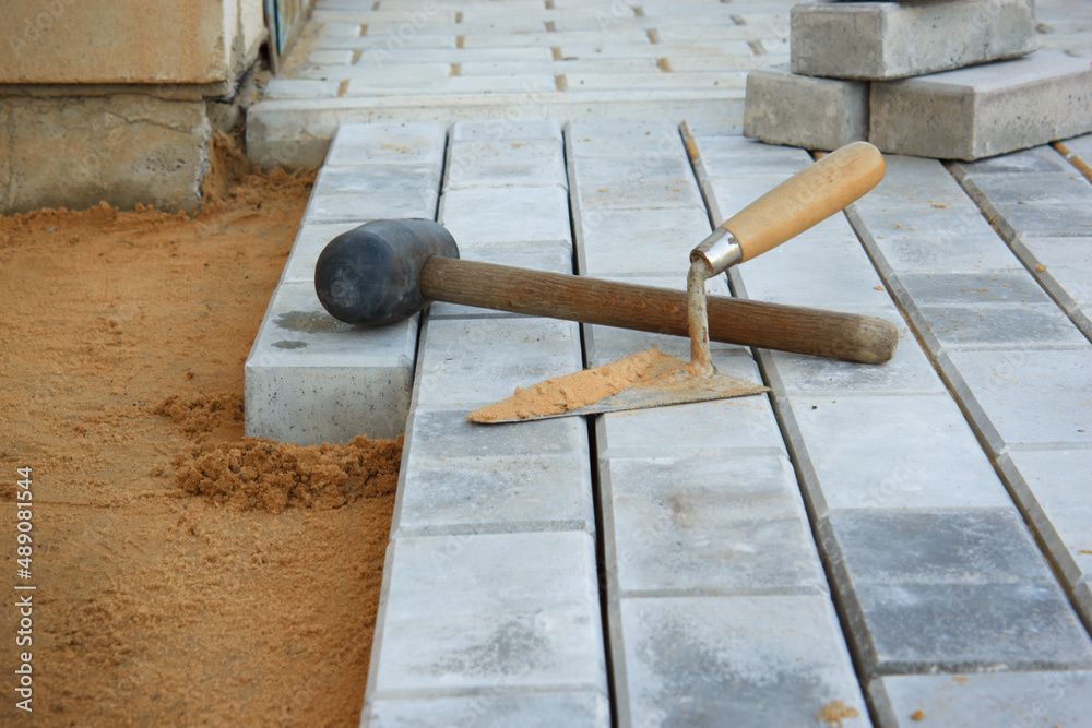 Stones for construction of pavement and tools Stock Photo | Adobe Stock