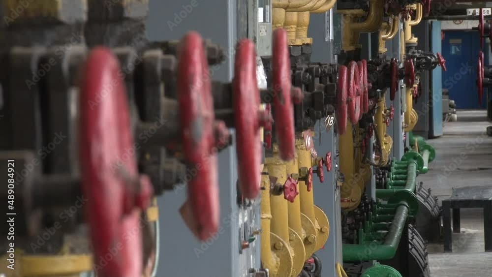 Boiler room with pipes, valves and sensors.Manometer, pipes and faucet ...