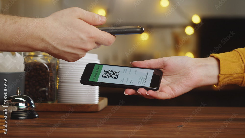 QR code, covid vaccination passport control close-up. Scanning ...