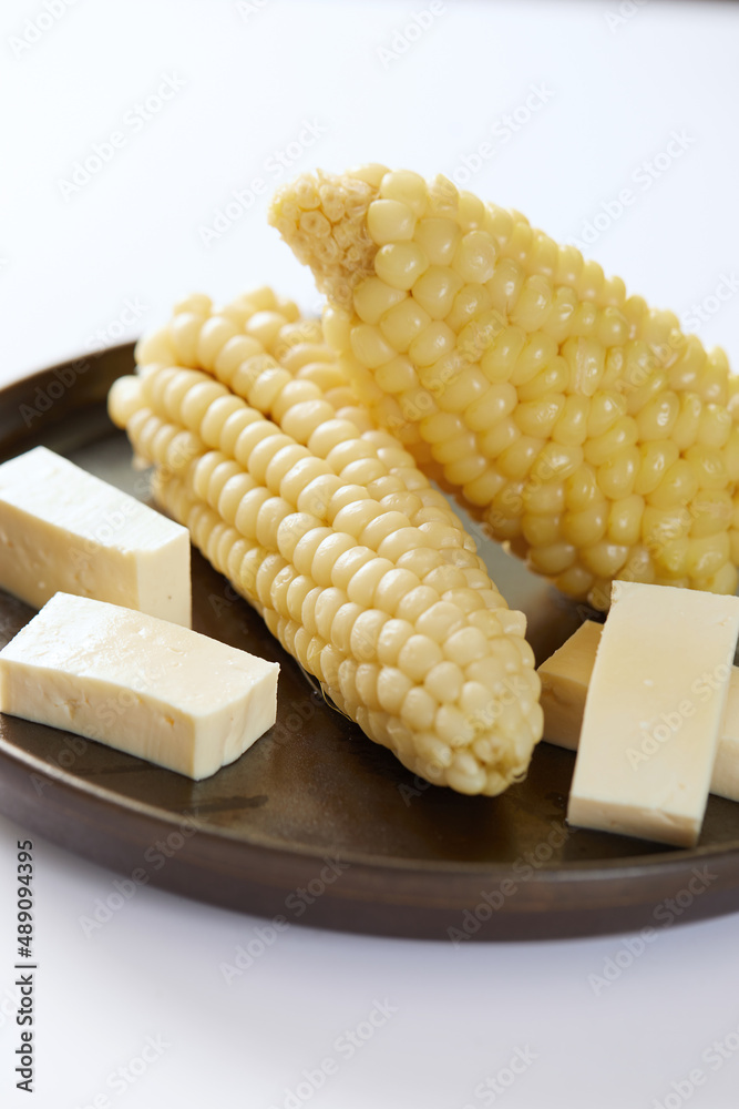 Choclo con queso a typical ecuadorian appetizer that consists of ...