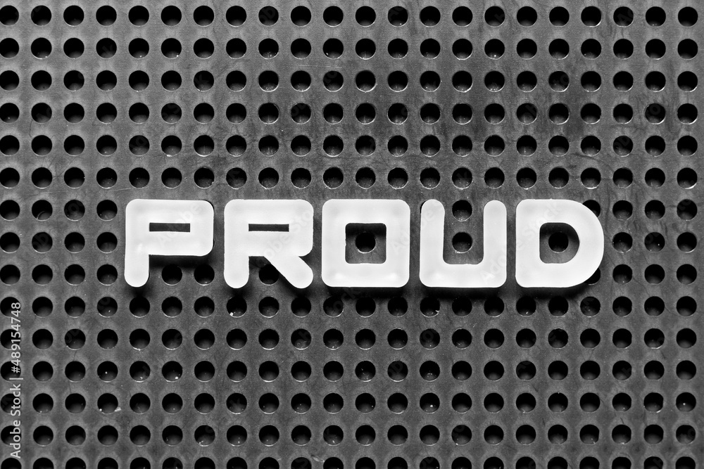 White alphabet letter in word proud on black pegboard background Stock ...