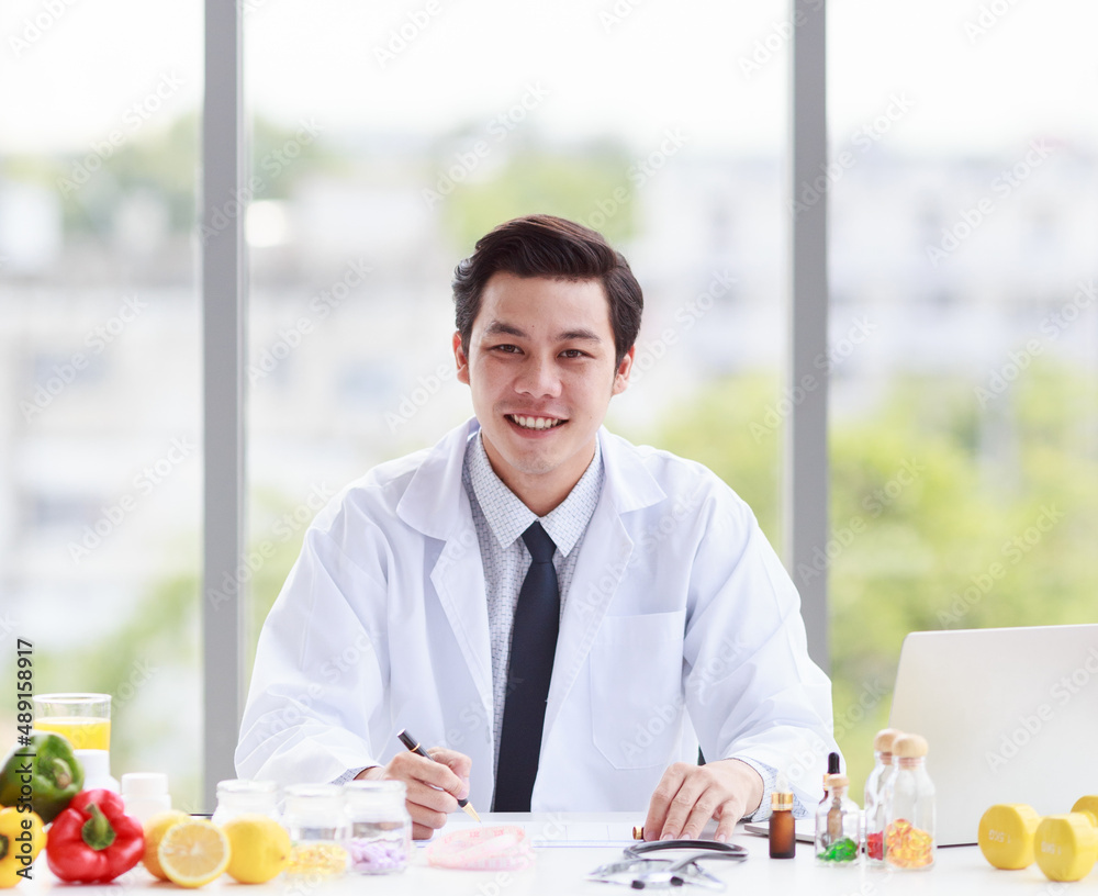Portrait studio shot Asian male professional nutritionist dietitian ...