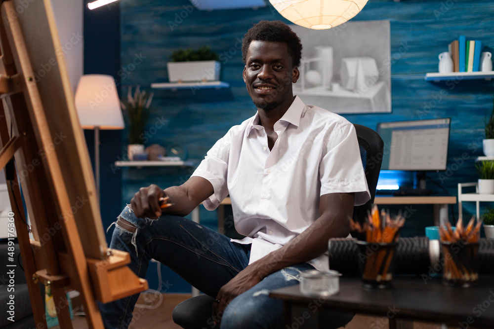 Portrait of smiling man artist smiling holding graphic pencil for ...