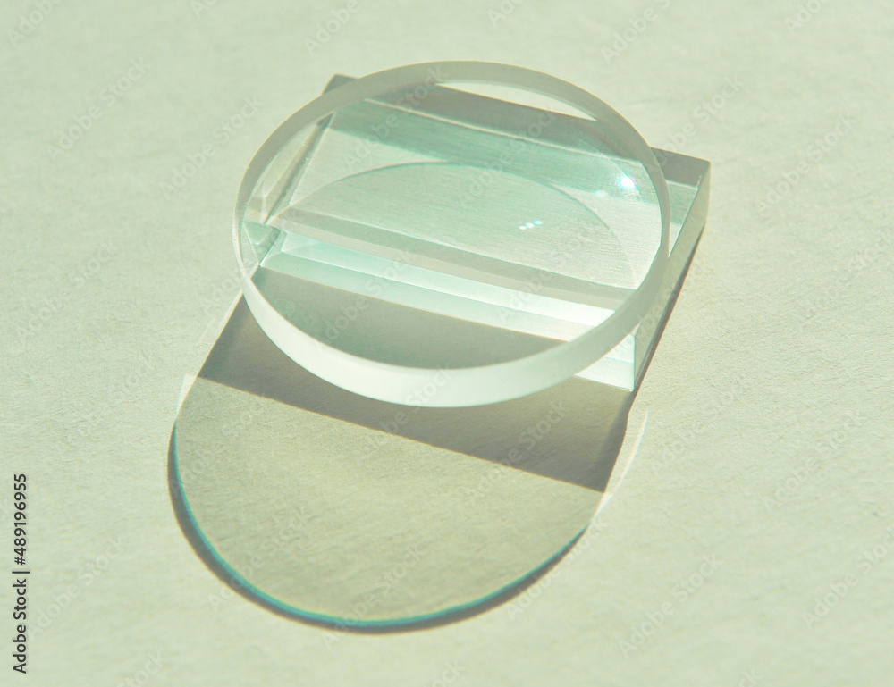 Closeup image of circular convex lens placed on top of clear ...