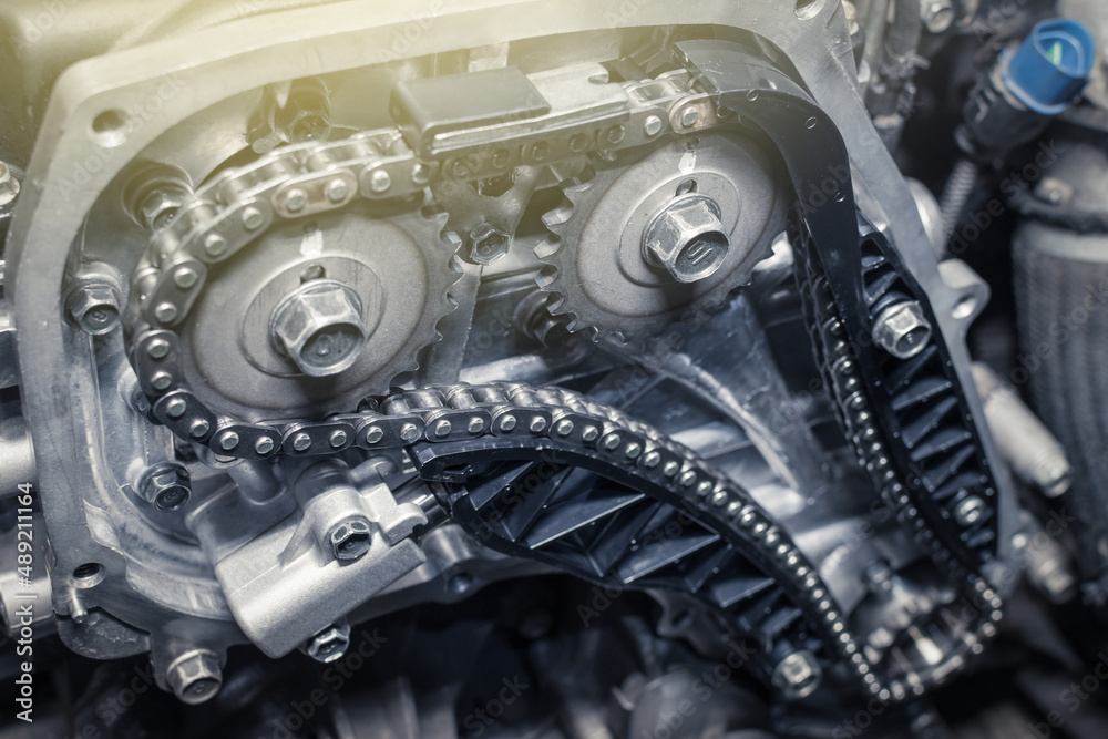 New car timing chain on a diesel old engine in a car workshop. Close up ...
