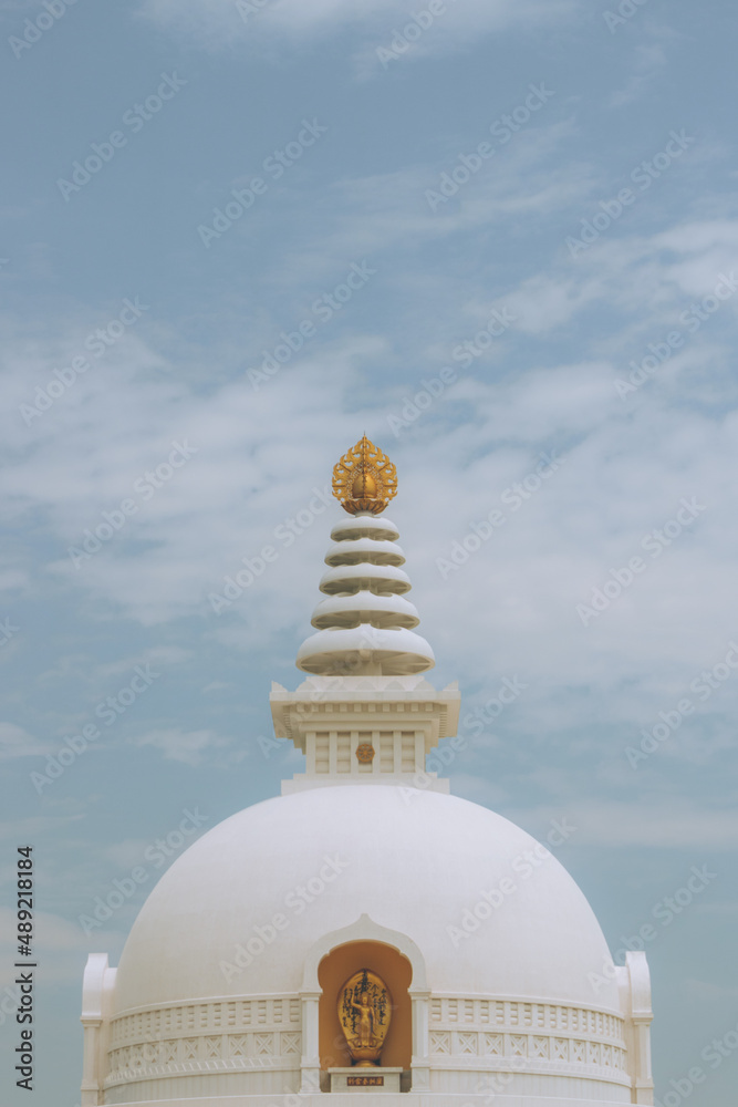 Beautiful view of the dome of Viswa Shanti Stupa Rajgir against a blue ...