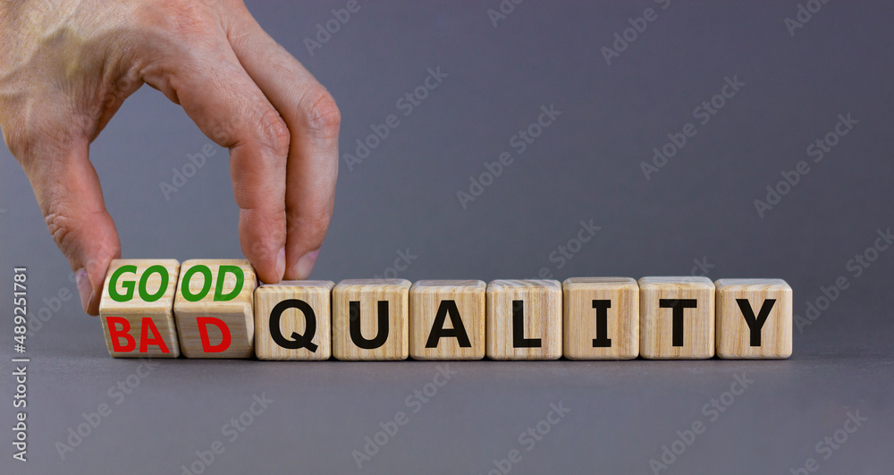 Good or bad quality symbol. Businessman turns cubes and changes words ...