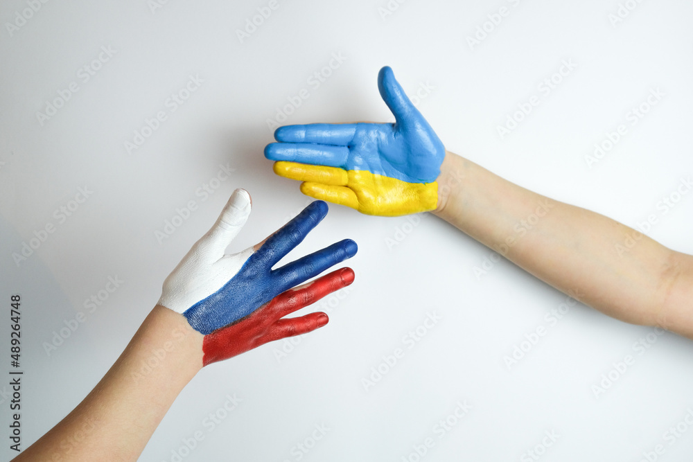 Hand painted in the colors of the flag of Russia and Ukraine. War in ...