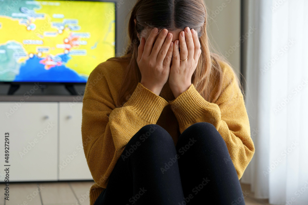 Russian invasion of Ukraine. Girl crying at home during bombs attack ...