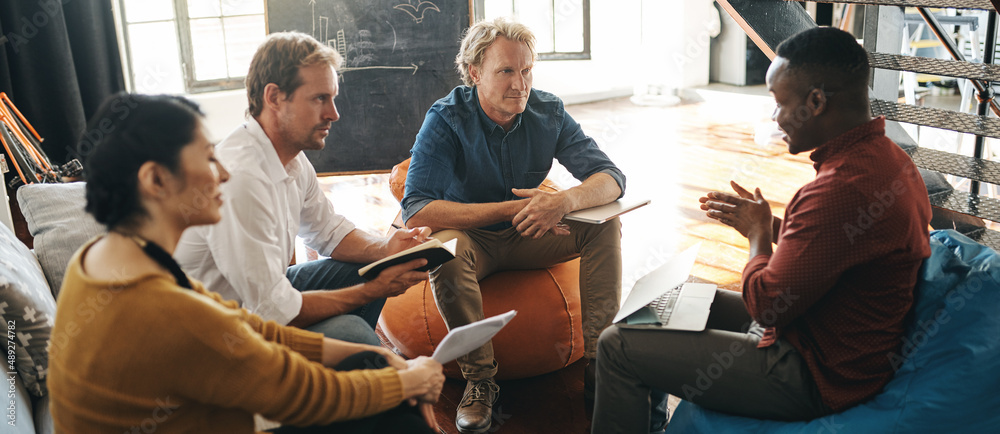 Keeping their creative ideas flowing. Shot of a diverse group of ...