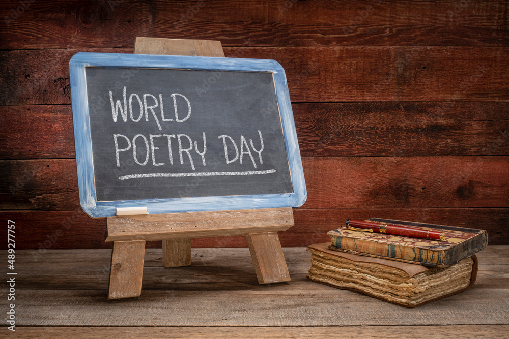 World Poetry Day, reminder of cultural event - white chalk handwriting ...