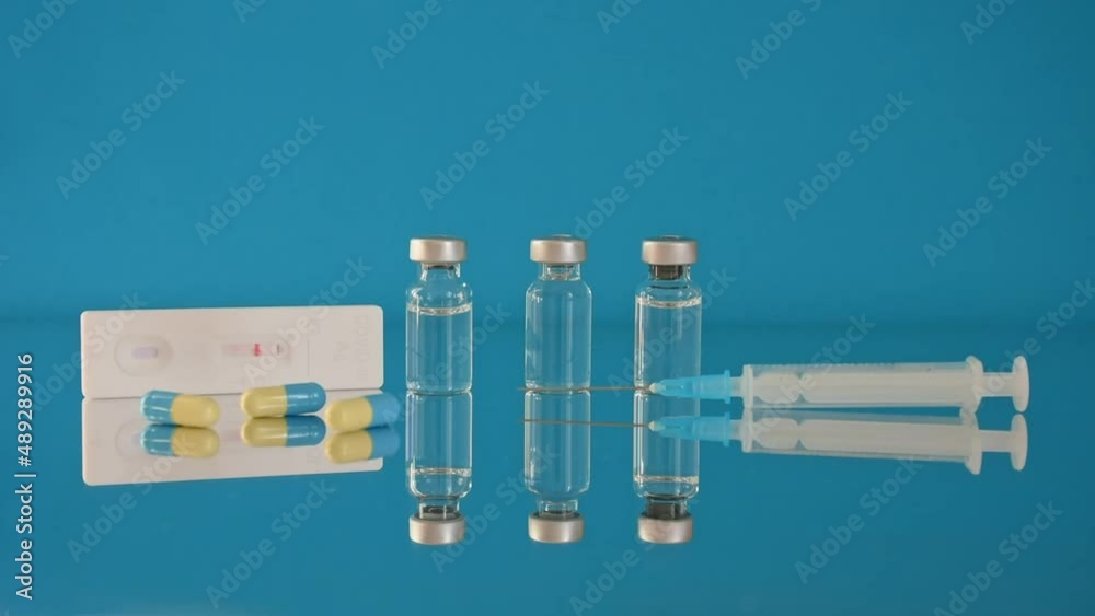 Vaccine bottles and syringe, treatment for COVID-19, influenza or flu ...