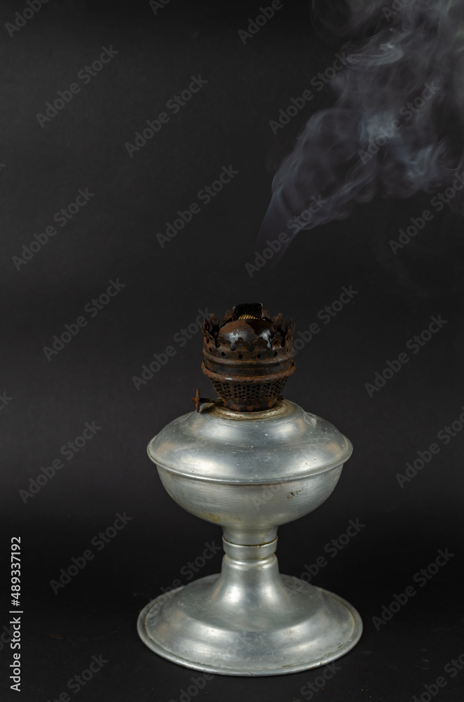 Smoking wick of an extinguished kerosene or oil lamp Stock Photo ...