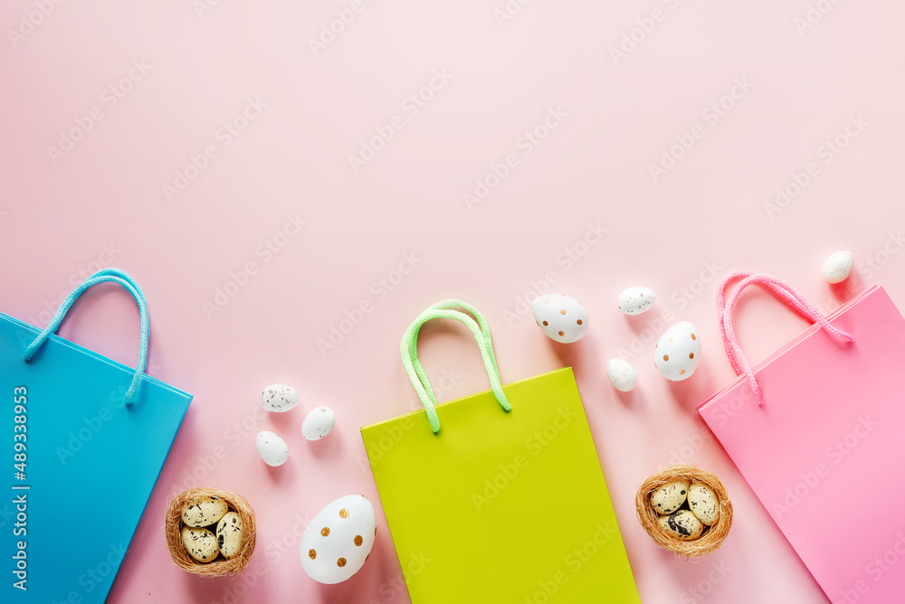 Easter shopping background with green and pink shopping bags with ...