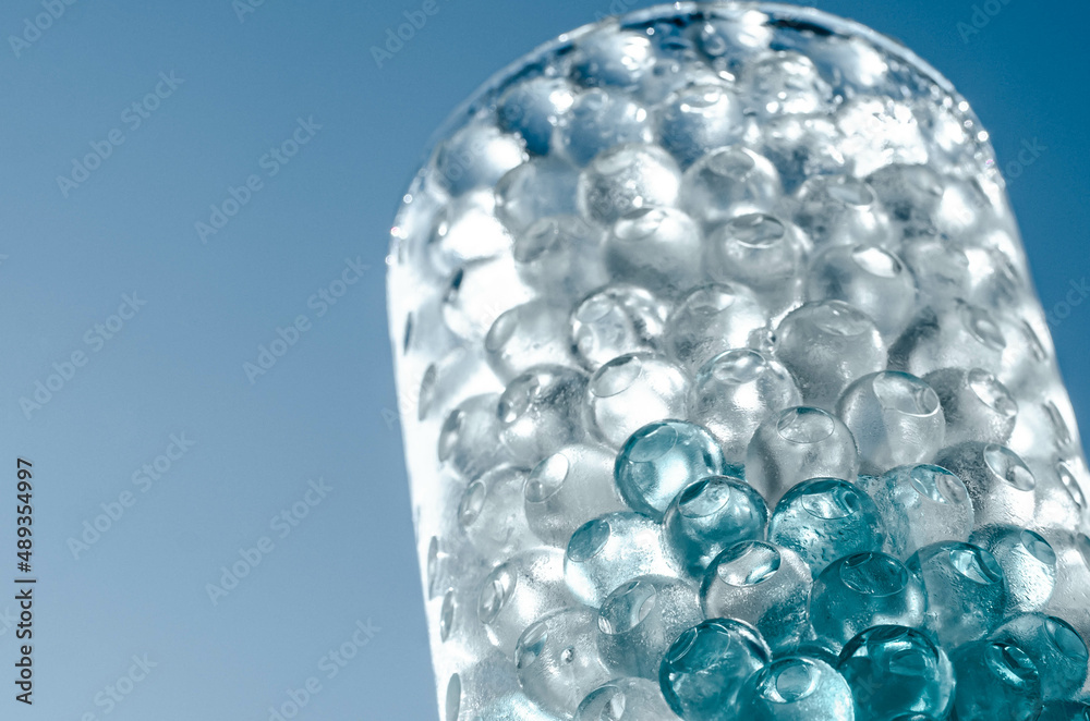 Hydrogel balls in a glass vase. Hydrogel as an art object or background ...