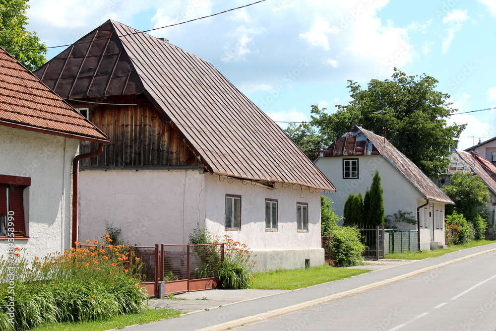 Row of small old rustic suburban family houses with dilapidated facade ...