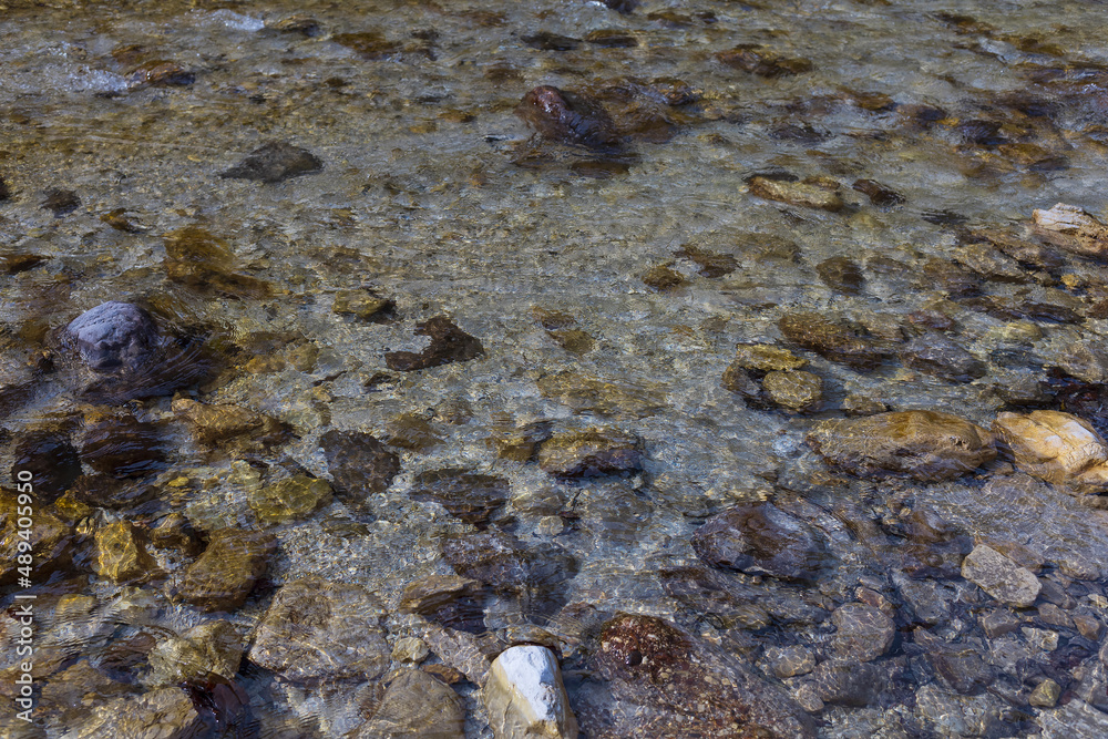 River water surface with stones and pebbles at the river bottom, nature ...