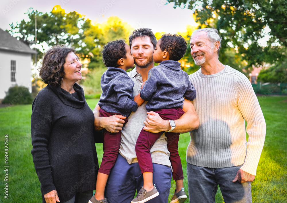 Portrait of three generations of of mixed race family in Midwestern ...