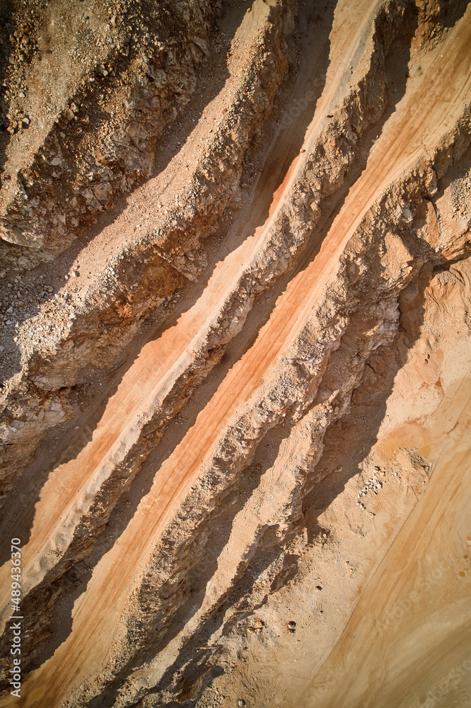 Sand and gravel open pit mining. Ledges of open pit sand quarry top ...