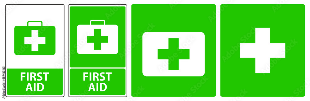 First aid sign. Green square and white cross symbol with FIRST AID text ...