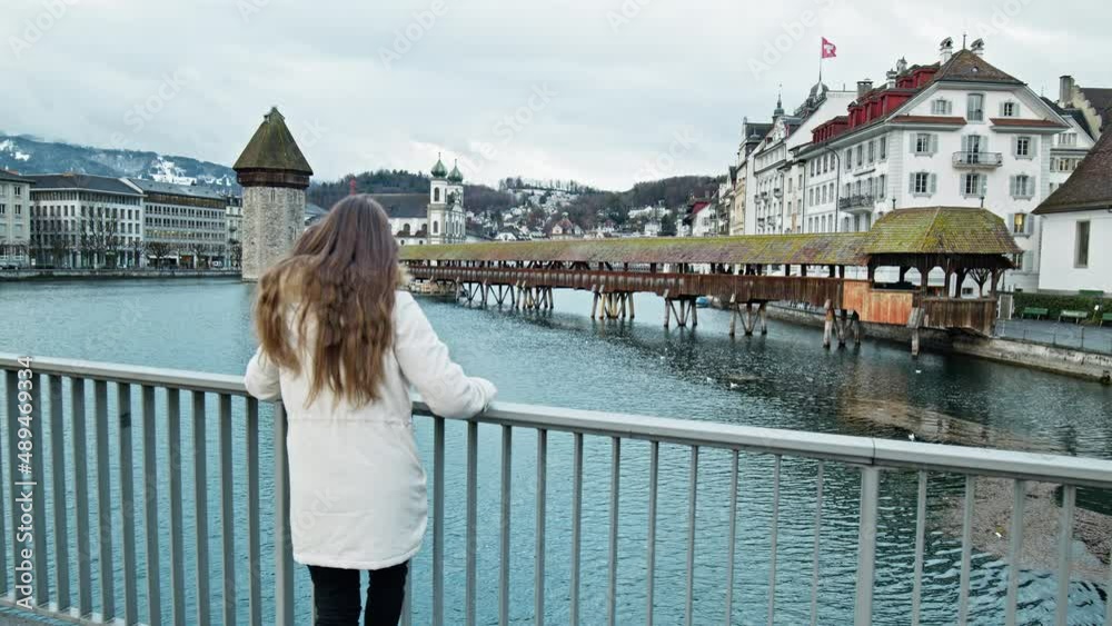 Tourist Girl looking at Chapel Bridge Kapellbrücke, Lucerne ...