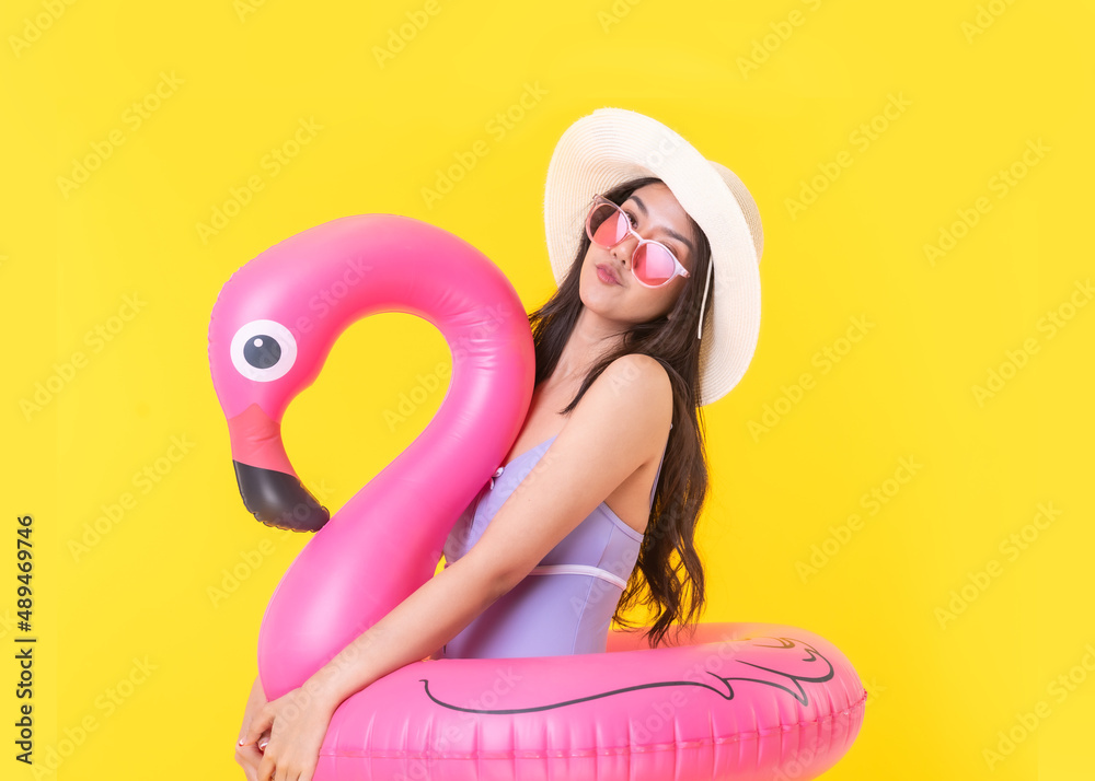Beautiful Sexy Asian Woman In Bikini And Smiling Standing On Yellow Background Isolated Summer