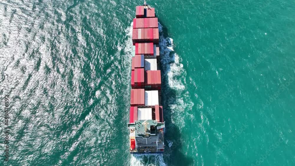 Stern of large cargo ship running in the ocean blue sea , container ...