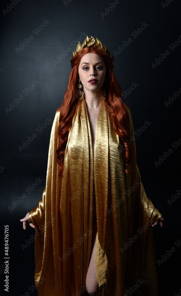 Full length portrait of pretty female model wearing grecian goddess ...