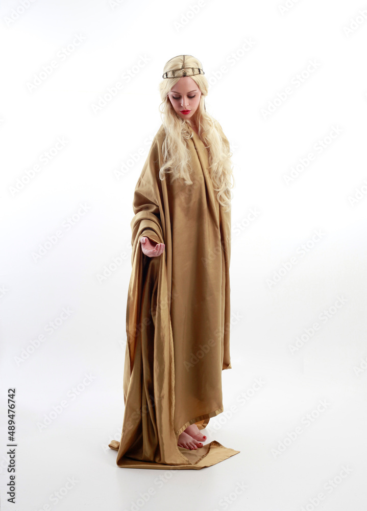 Full length portrait of pretty female model wearing grecian goddess ...