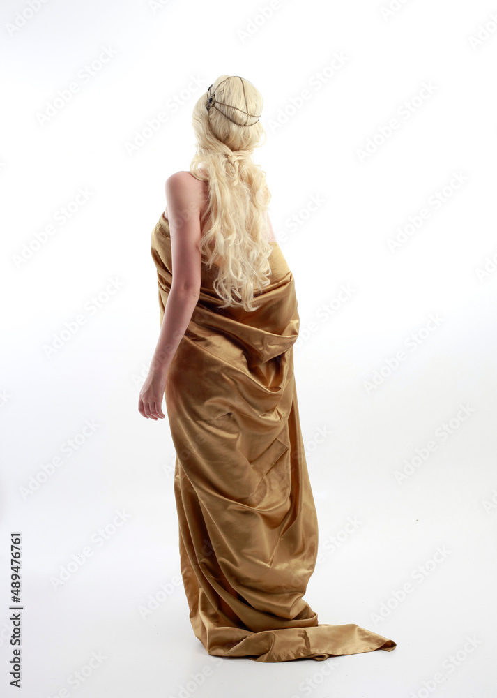 Full length portrait of pretty female model wearing grecian goddess ...