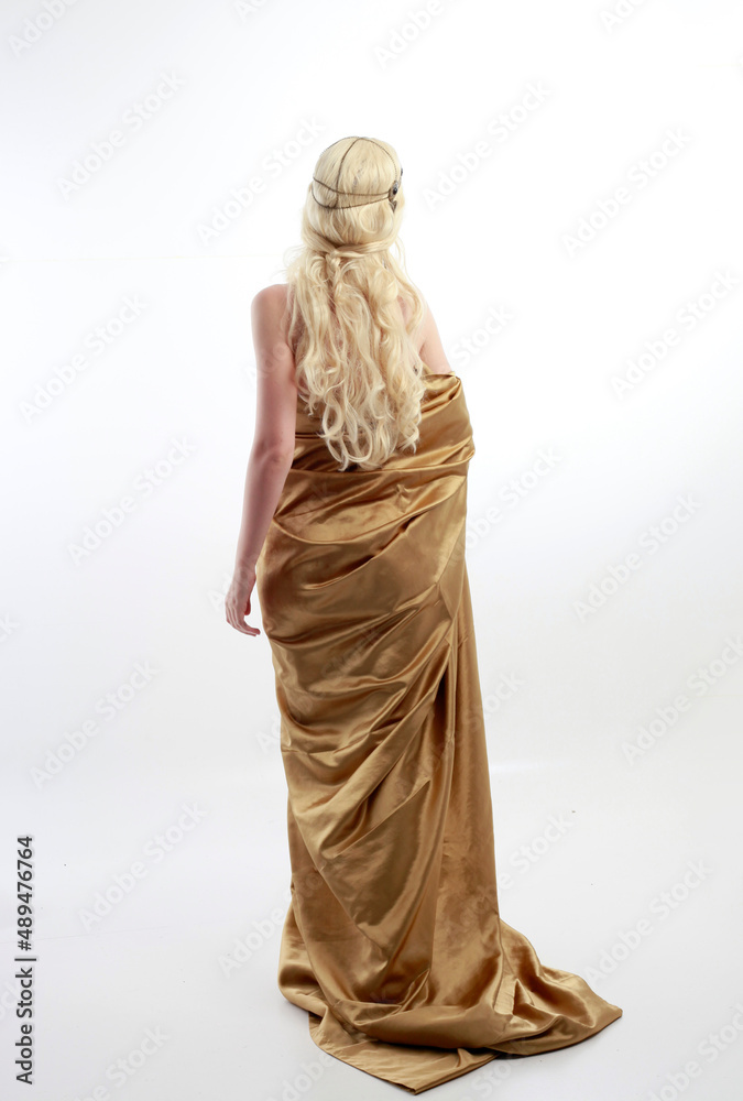 Full length portrait of pretty female model wearing grecian goddess ...