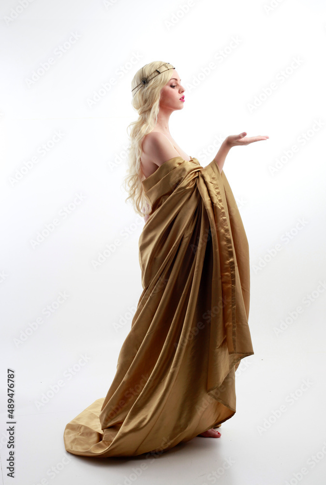 Full length portrait of pretty female model wearing grecian goddess ...
