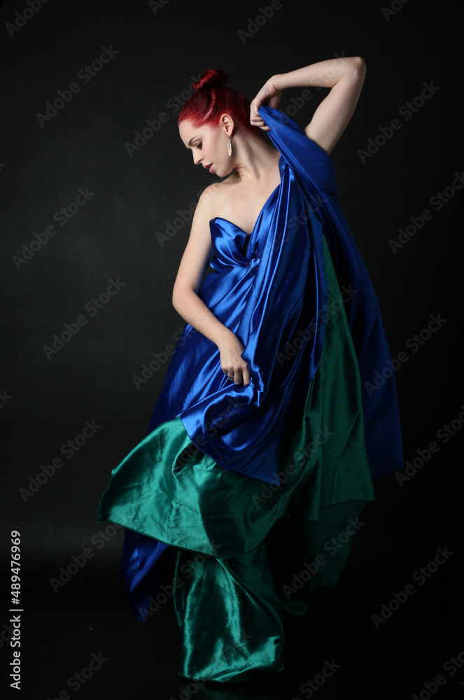 Full length portrait of pretty female model wearing grecian goddess ...
