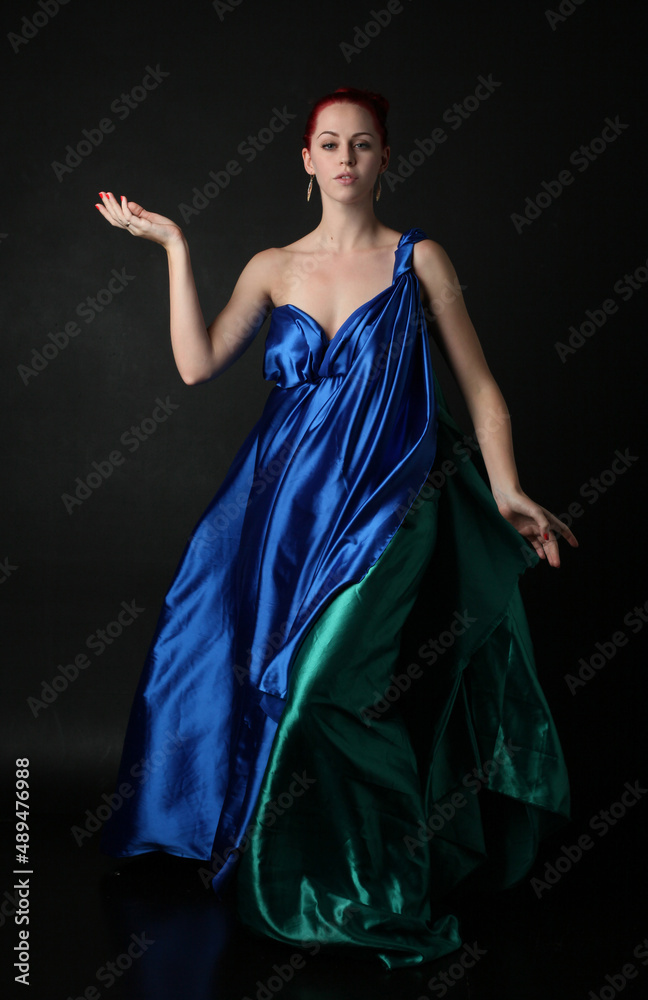 Full length portrait of pretty female model wearing grecian goddess ...