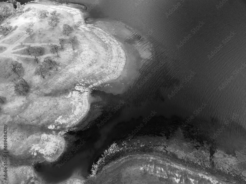 Eungella Dam Queensland Australia with low water levels showing texture ...