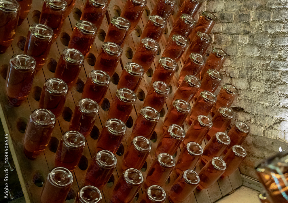 Sparkling wine production by traditional method in underground cellars ...