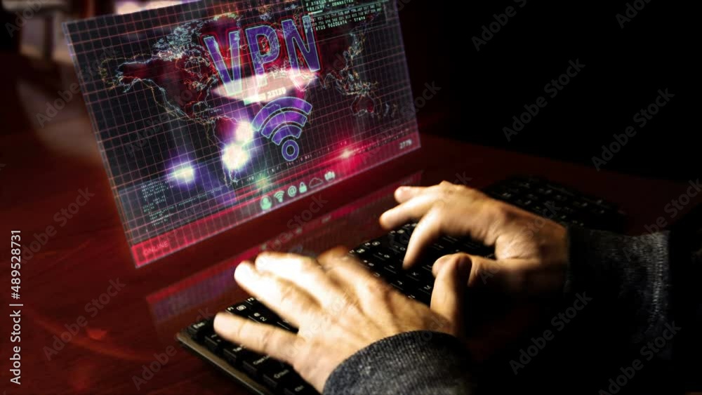 Hacker typing on the keyboard with VPN on virtual display on desk. VPN ...