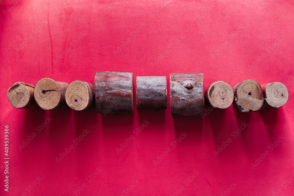 Conceptual image, with pieces of tree trunk arranged in positions that ...
